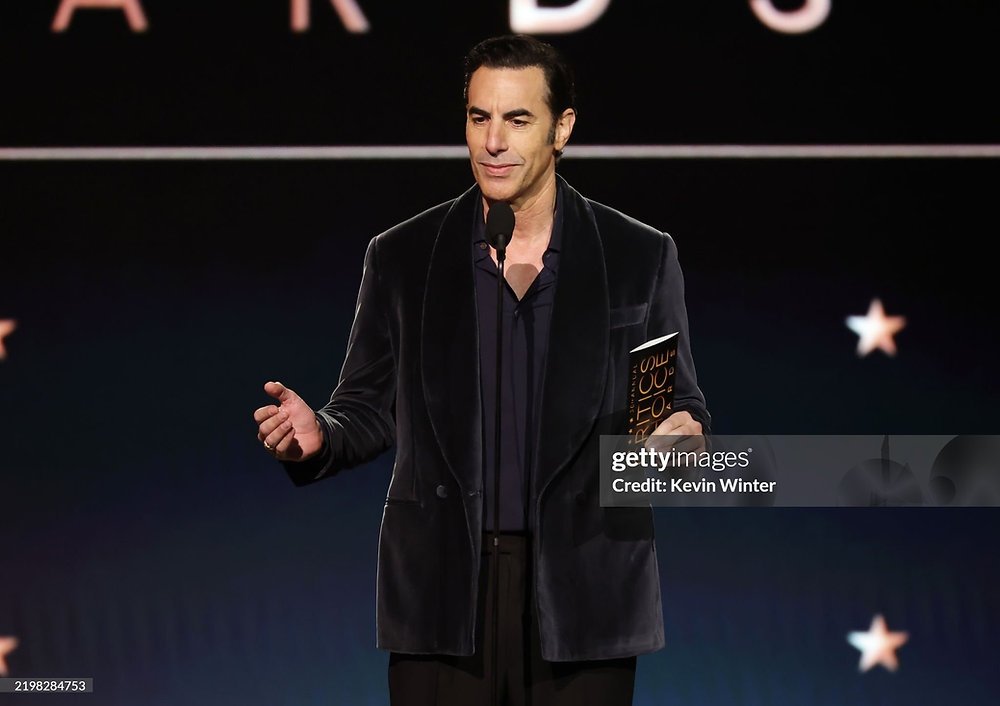 Sacha Baron Cohen Stuns in Thom Sweeney at the 30th Annual Critics ...