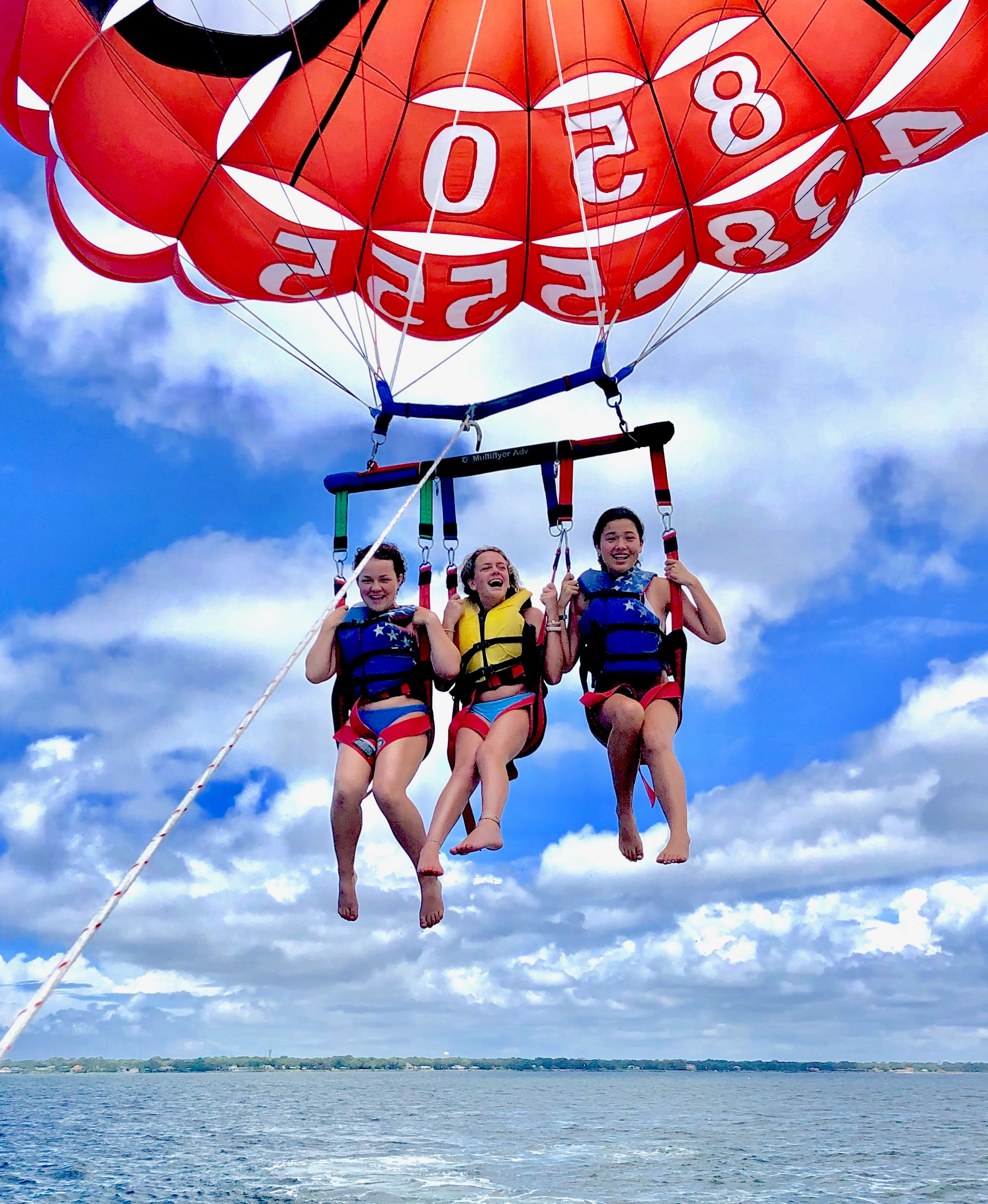 Parasailing in Destin behind Pompano Joe's Seafood in Miramar Beach