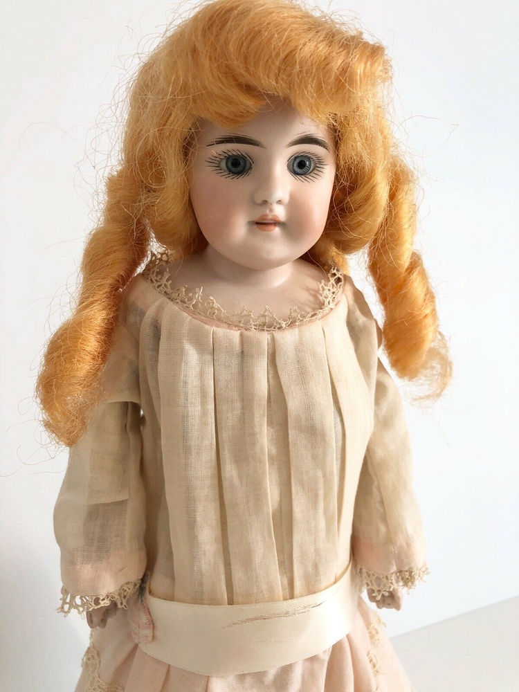 We are trying to identify this beautiful doll and need help with that ...