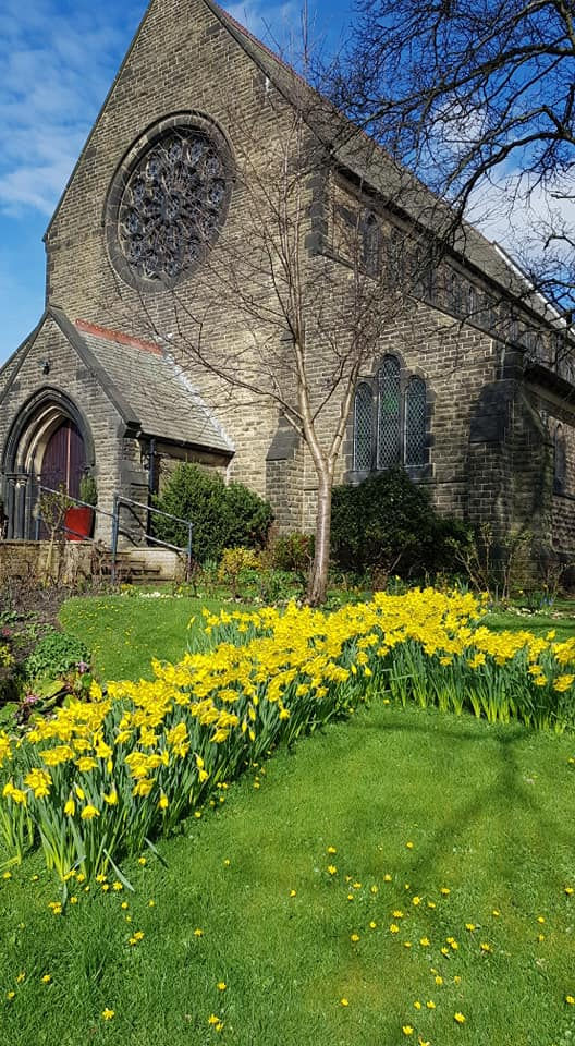 Great Picture of the Church with the flowers in bloom!