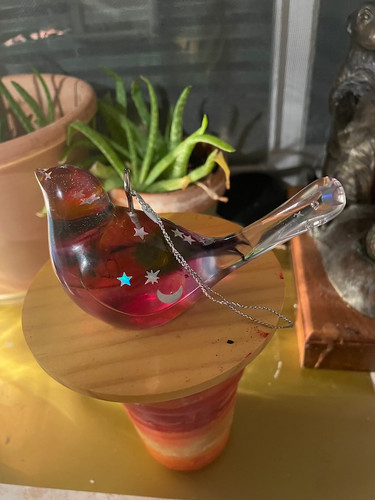 Clear red translucent bird ornament with stars and moons | Cribbage King