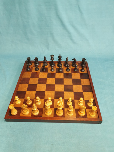 Late 19 century wooden chessboard with early 20th century chess set ...