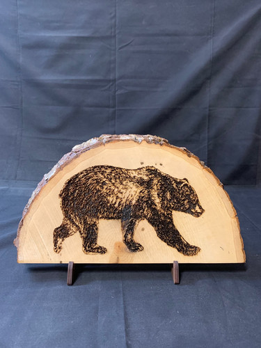 Bear lasered on live edge Cedar. | Atlantic Laser Works