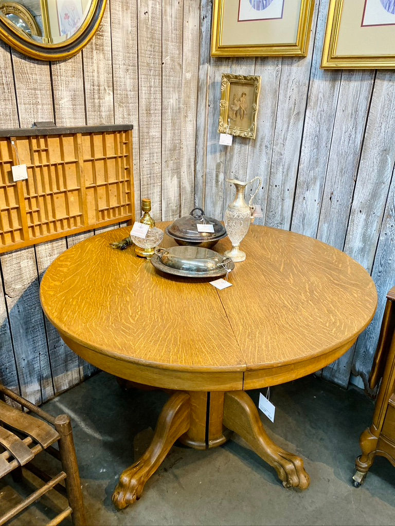 Lions claw foot table antique store
