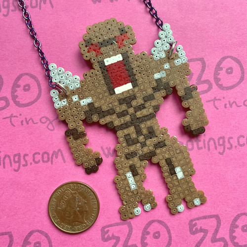 Buy our DOOM 'Imp' Pixel Necklace brought to you by ZoZoTings.com