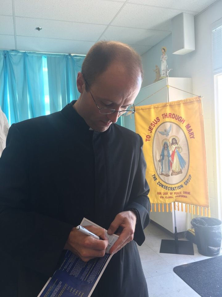 Fr. Brian Dinkel Signs Up for Consecration