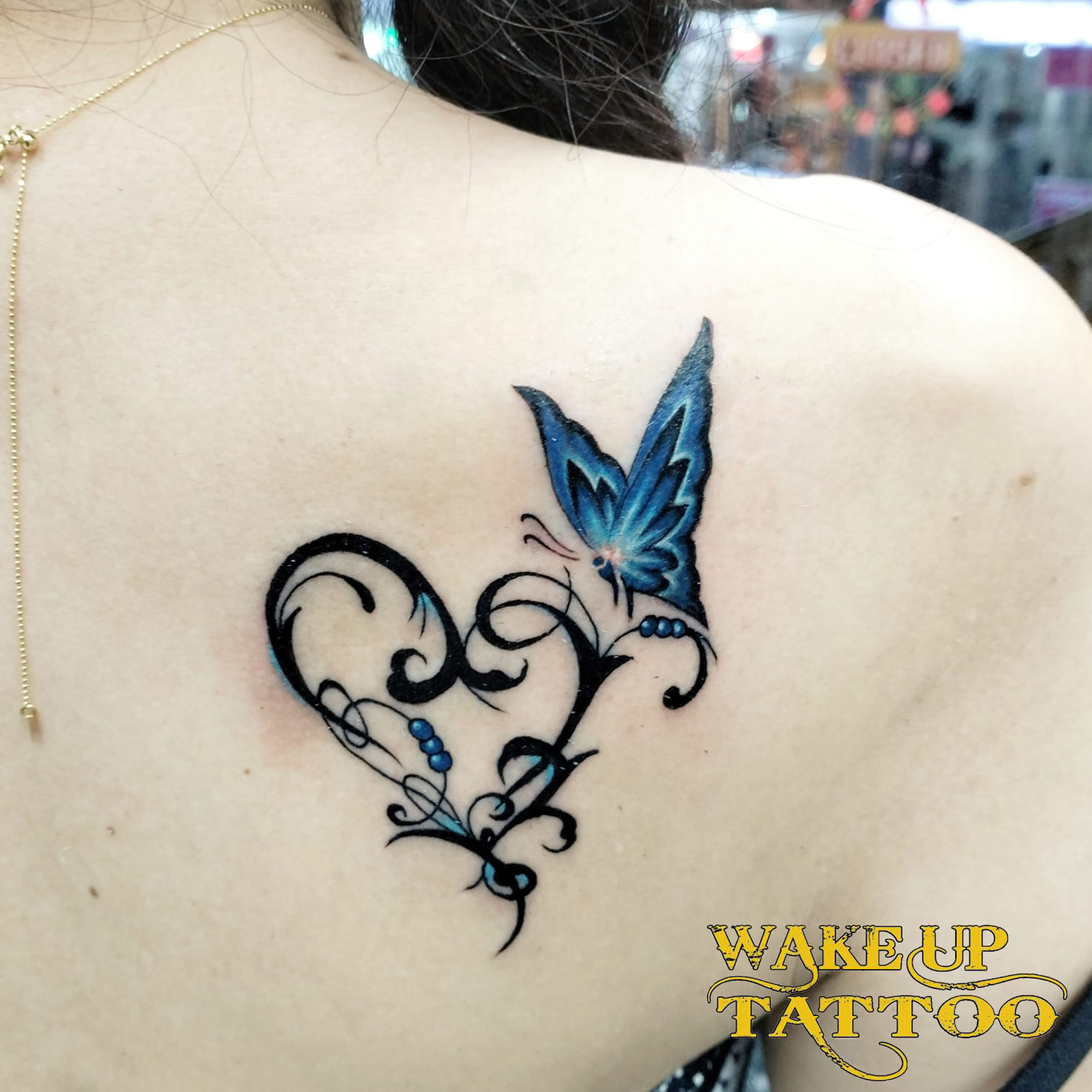 flower and tribal butterfly tattoo|Phuket Patong|Wake up Tattoo