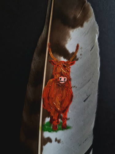 Heiland coo painted on a buzzard feather | Western Isles Designs