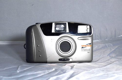 Câmera Analógica Mirage Titanium | Paulo Flash Digital