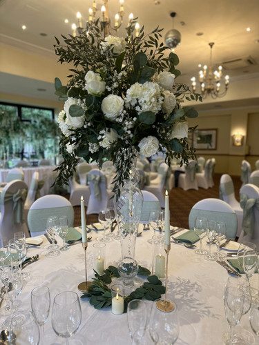 Large floral arrangement in tall glass vase | Twinkles And Tiaras