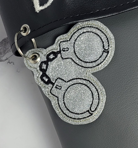 Handcuff snap tab and eyelet | Asylum Handicrafts