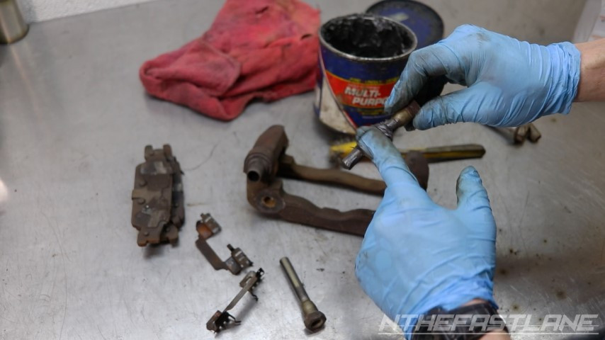 Greasing slider bolt