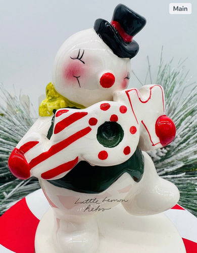 Anthropomorphic Snowman holding the word JOY | Little Lemon Retro