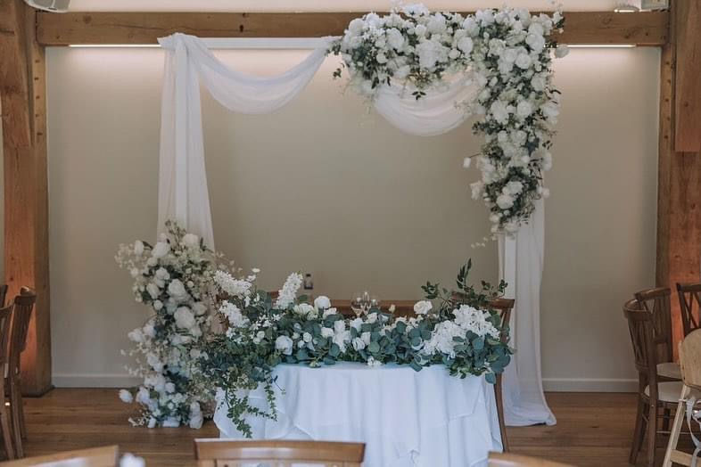Luxury white arch with deluxe flowers | Perfectly Unique