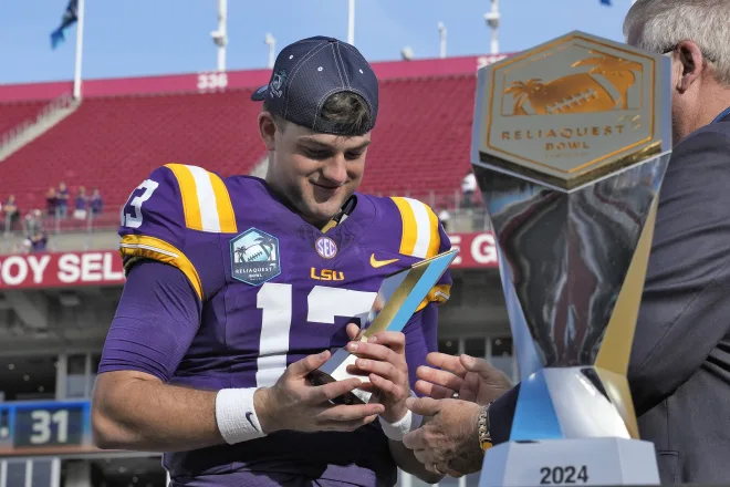 NUSS BUS RUNS OVER WISCONSIN FOR 395 YARDS & A 35-31 COMEBACK WIN