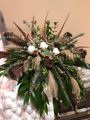 A Hunter and fisherman’s casket spray | Dunlap Flower Shop