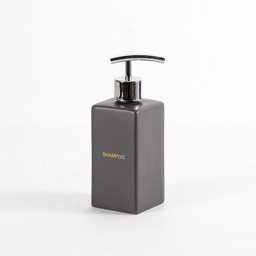 GRAPHITE shampoo dispenser in matte black with gold wordings | OVO