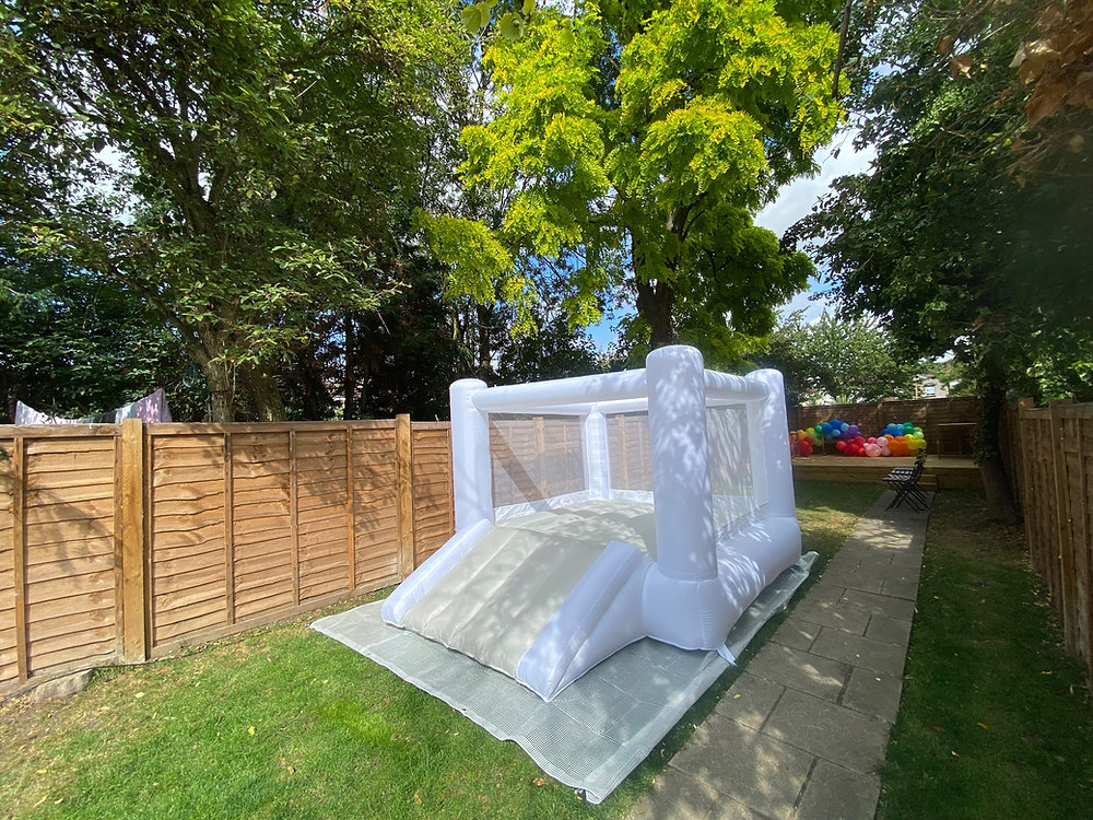 A Magical Birthday Celebration: Our Small White Tots Bouncy Castle in ...