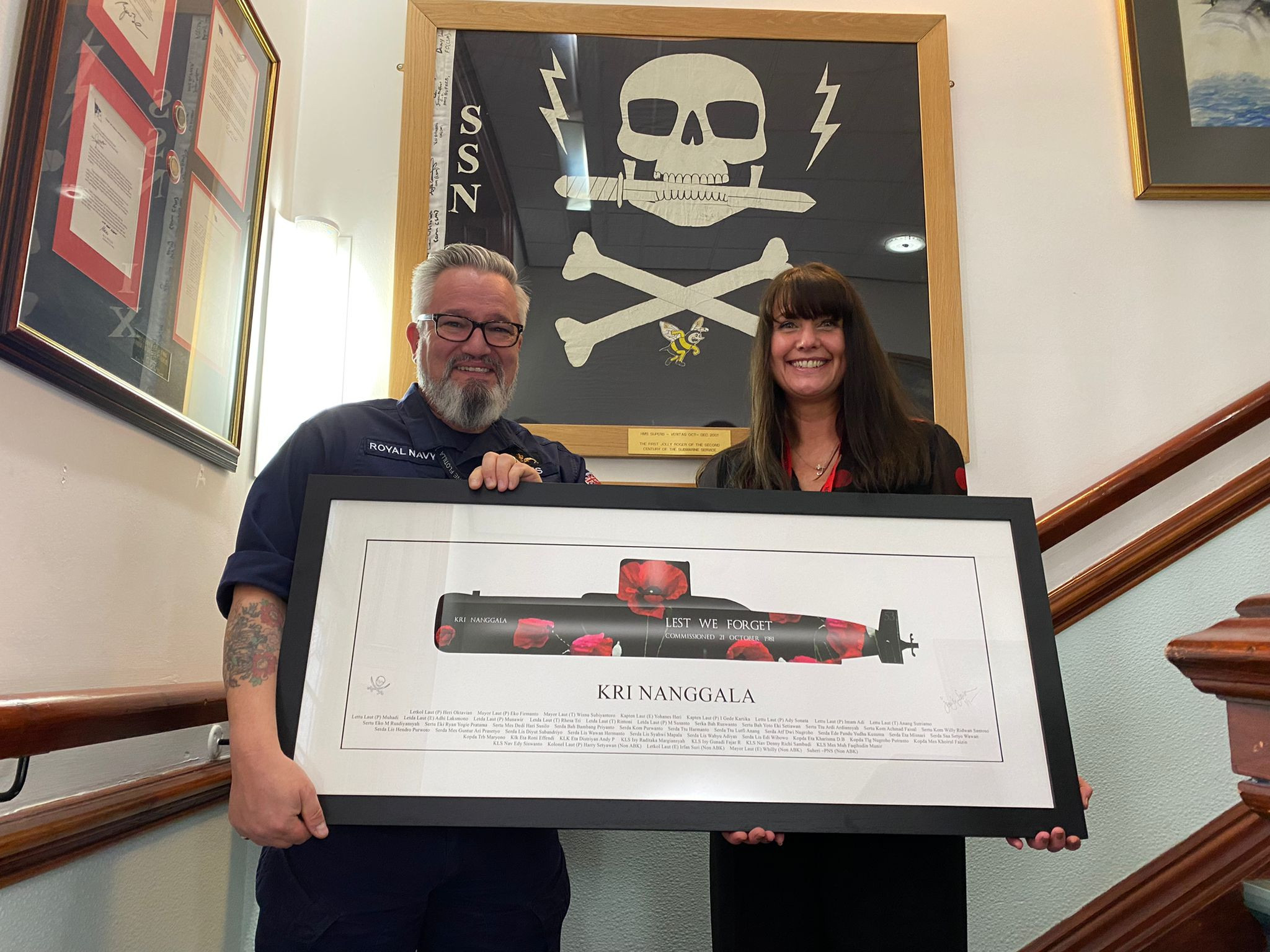 We present a special piece of art to Commodore Jim Perks CBE