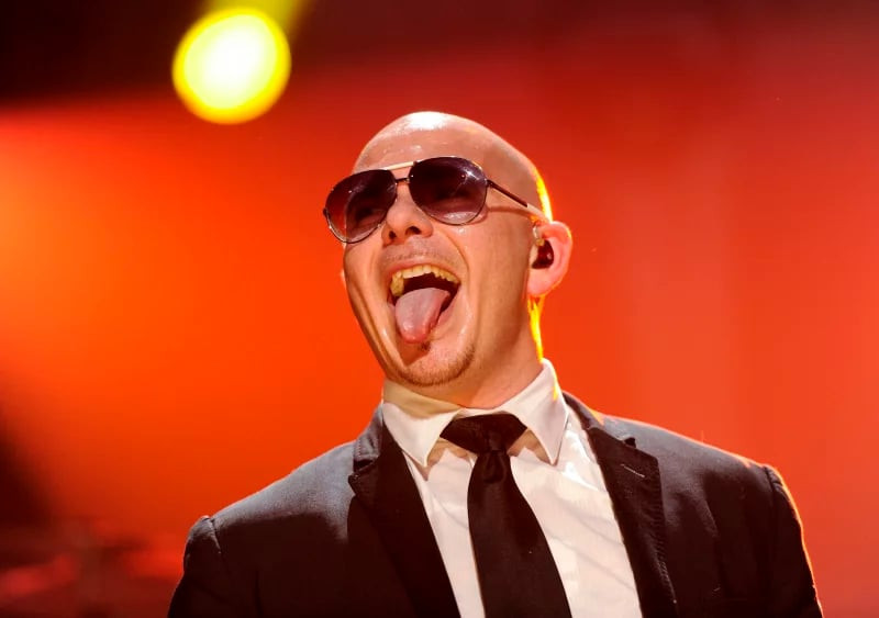 Pitbull Asks Fans to Wear Bald Caps to Concert for Guinness Record Bid