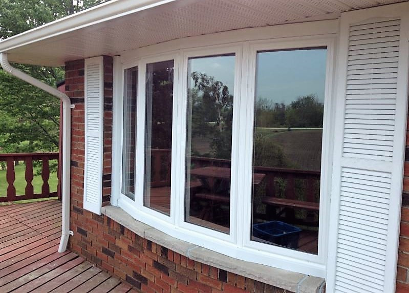 Bow Window with Louvered Shutters