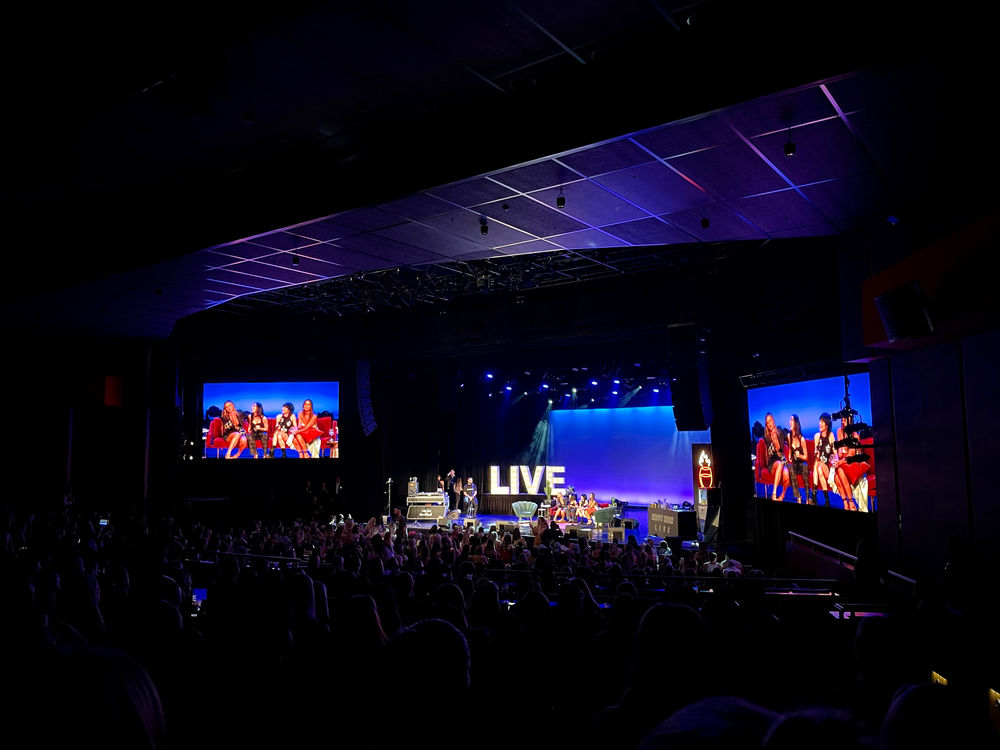 Going LIVE for Happy Hour with big light letters on stage