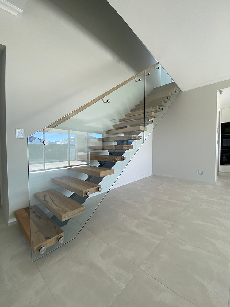 Byfinesse architectural stairs with solid tread and glass balustrade