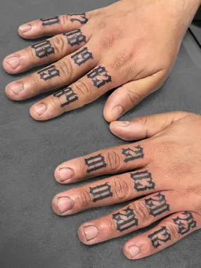 script letter tattoo