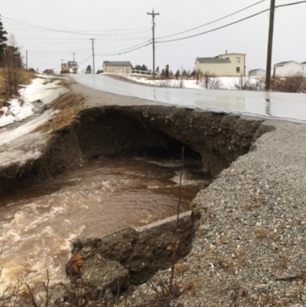 Roads closed and power outages rise in Newfoundland