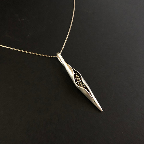 Flying Silver Studio’s Silver Seed Pod Pendant – Handmade Elegance